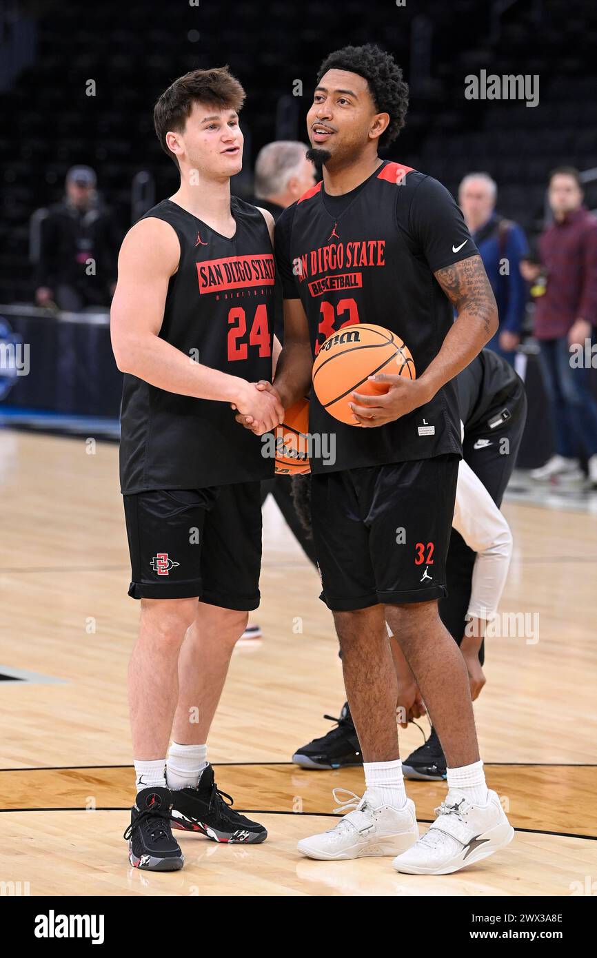 Boston, Mass. 27th Mar, 2024. San Diego State Aztecs guard Ryan Schwarz (24) and guard Desai ...