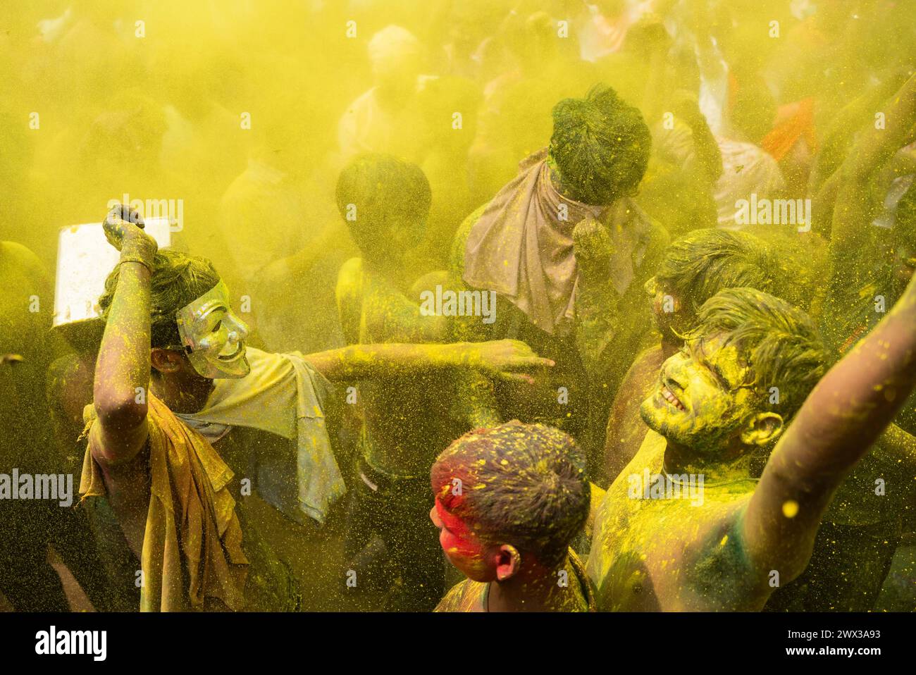 Revellers dancing in the beat of music as they celebrate Holi on a ...