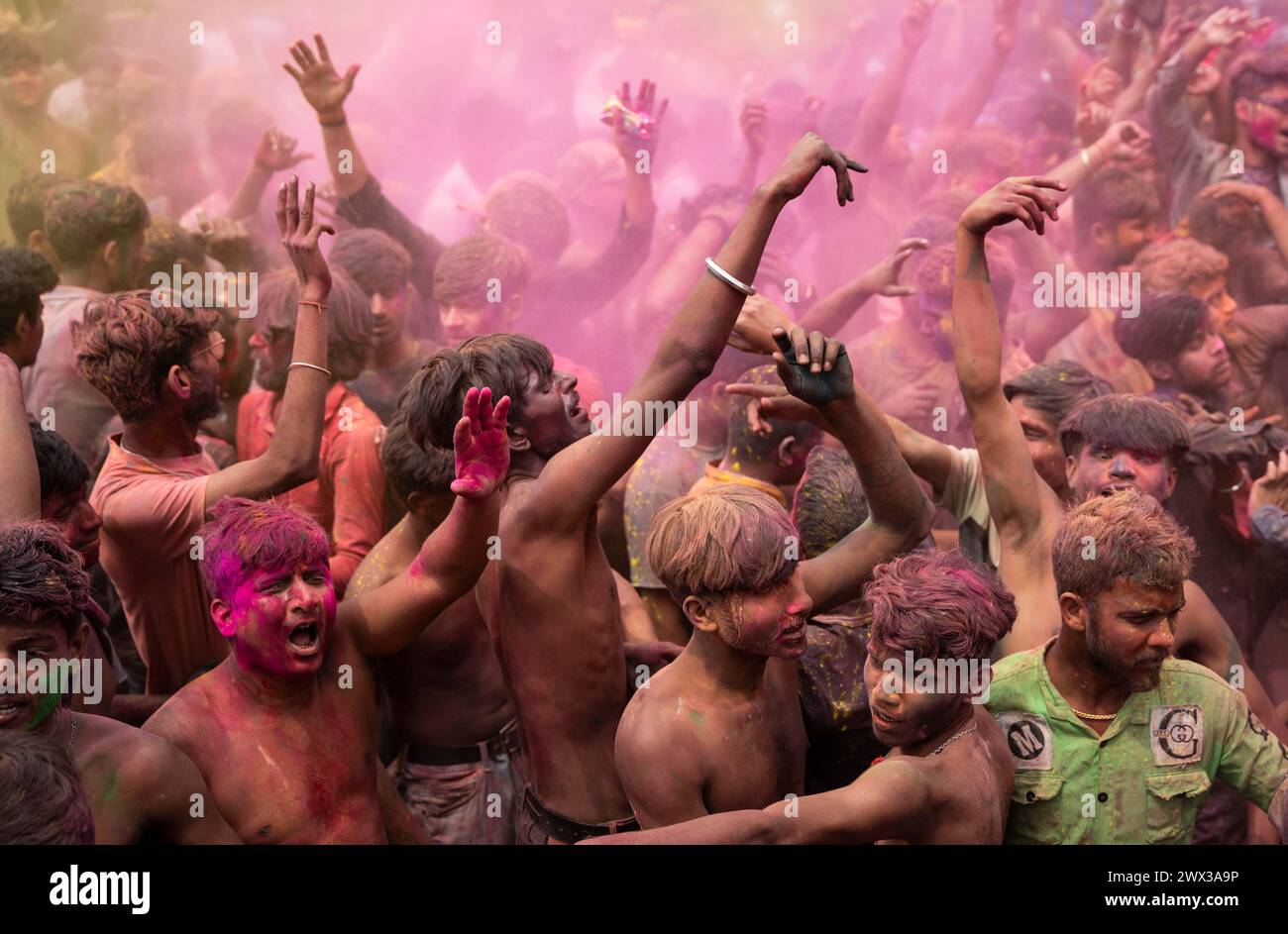 Revellers dancing in the beat of music as they celebrate Holi on a ...