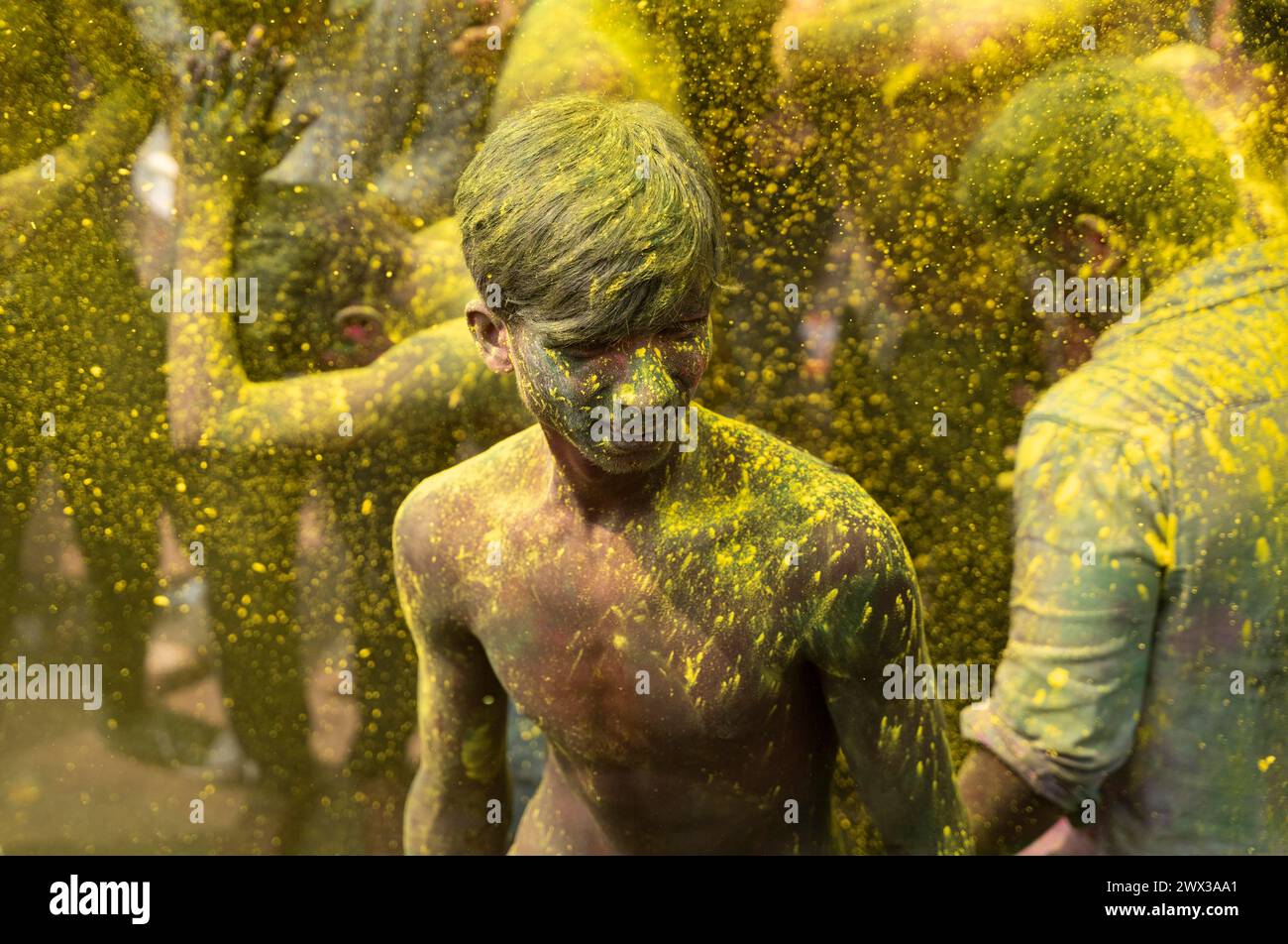 Revellers dancing in the beat of music as they celebrate Holi on a ...