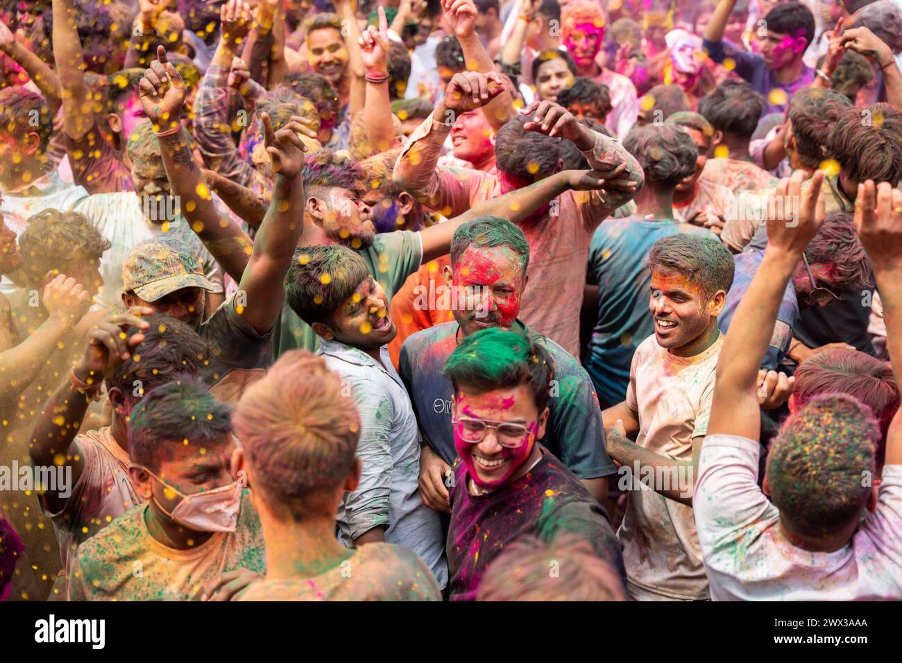 Revellers dancing in the beat of music as they celebrate Holi on a ...