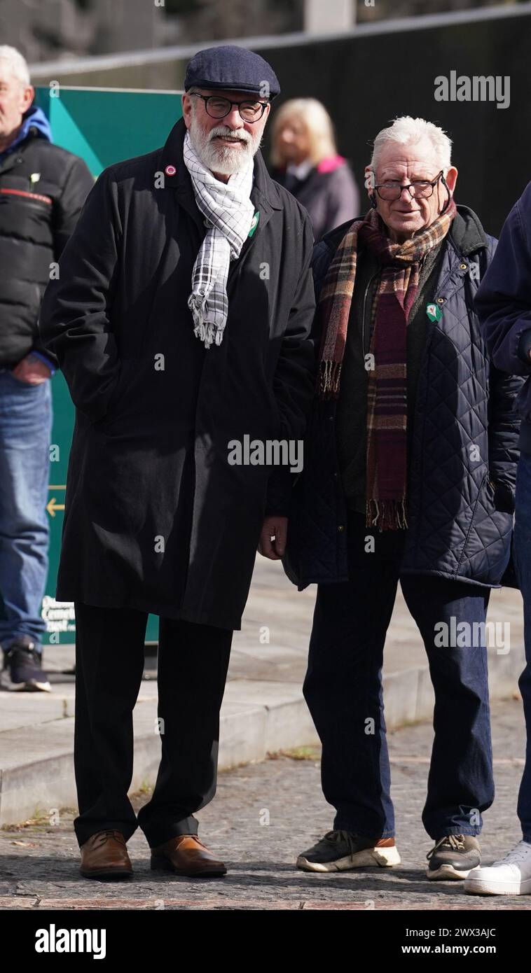 Former Sinn Fein president Gerry Adams (left) stands with Nicky Kelly ...