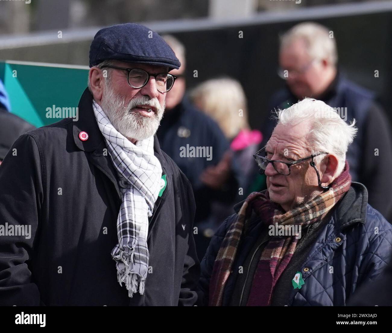 Former Sinn Fein president Gerry Adams (left) speaks to Nicky Kelly as ...