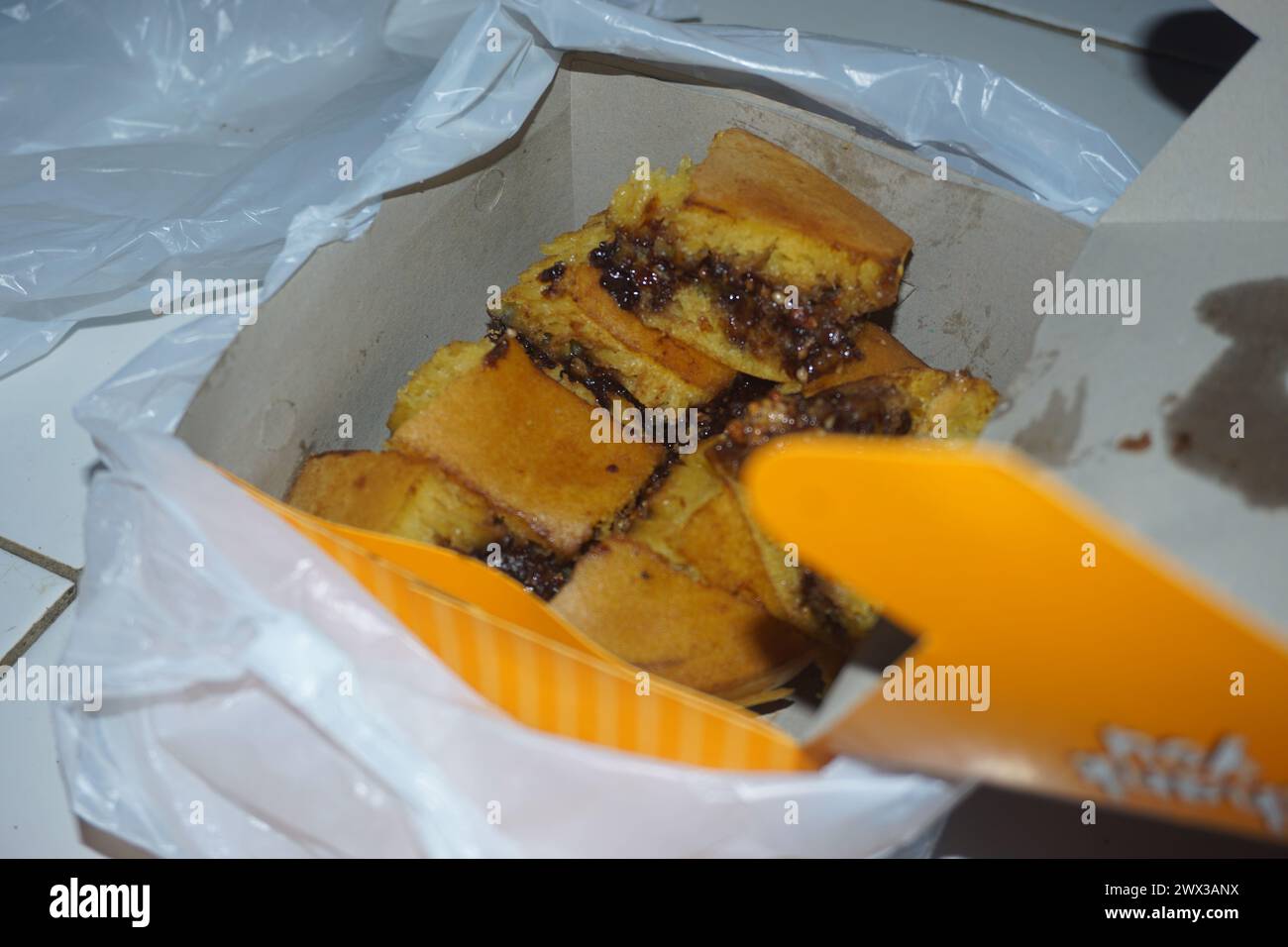 Photo of cheese banana martabak in a box, a typical Indonesian snack ...