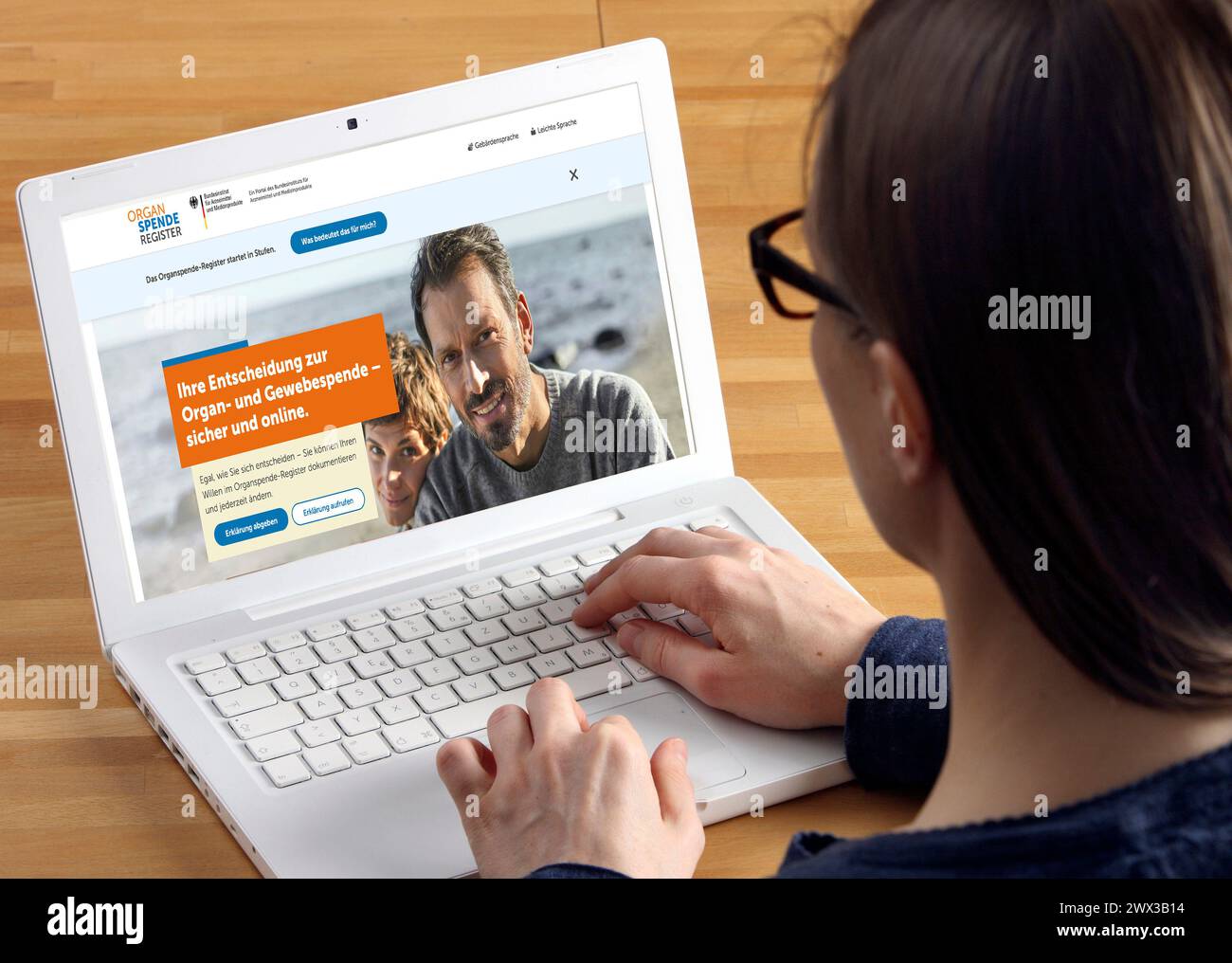 Symbolic image of organ donation register, person informs himself about ...