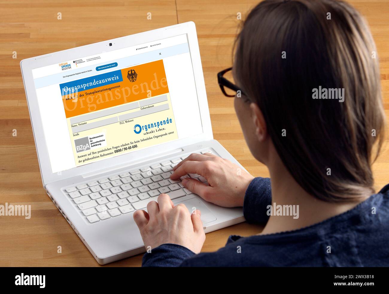 Symbolic image of organ donation register, person informs himself about ...