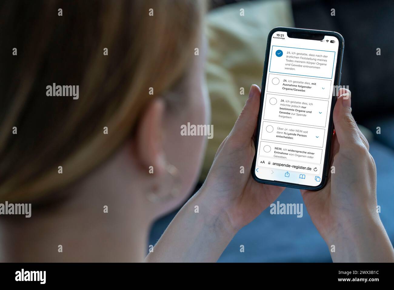 Symbolic image of organ donation register, person informs himself about ...