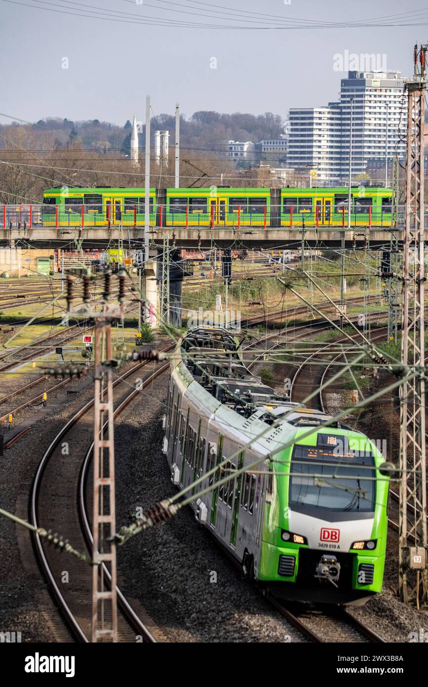 Streetcar line 112 on bridge, S-Bahn train on the railroad line between ...