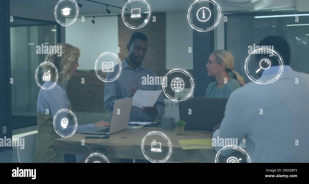 Image of icon in circles over diverse coworkers discussing reports in ...