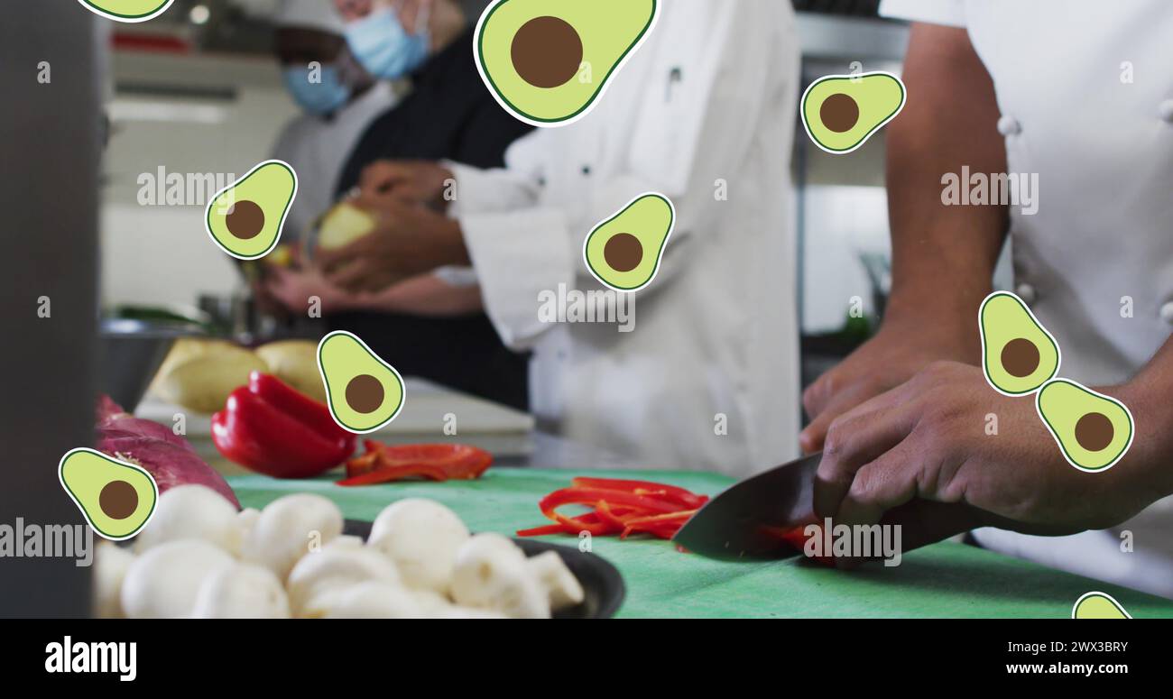 Image of avocado icons over diverse chefs cooking in kitchen. fashion ...