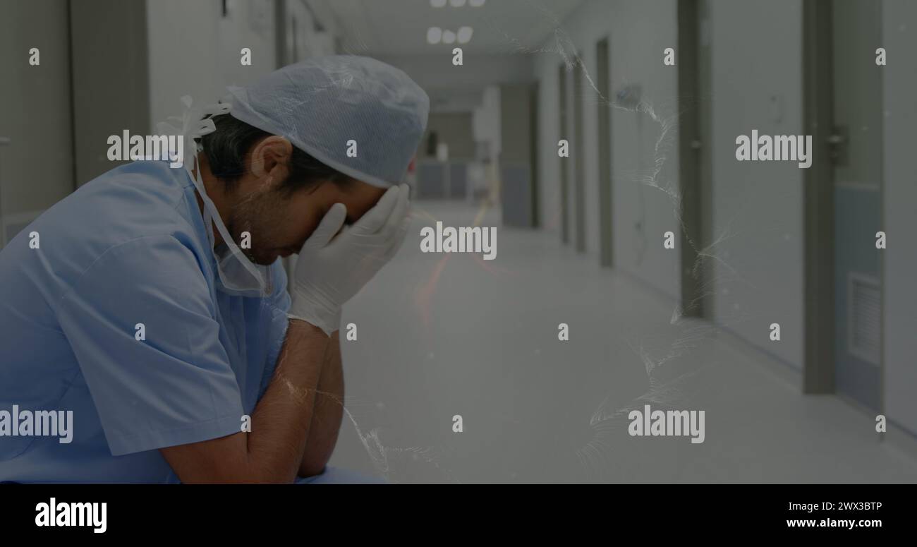 Image of moving spiral over sad biracial male nurse in hospital. mental ...