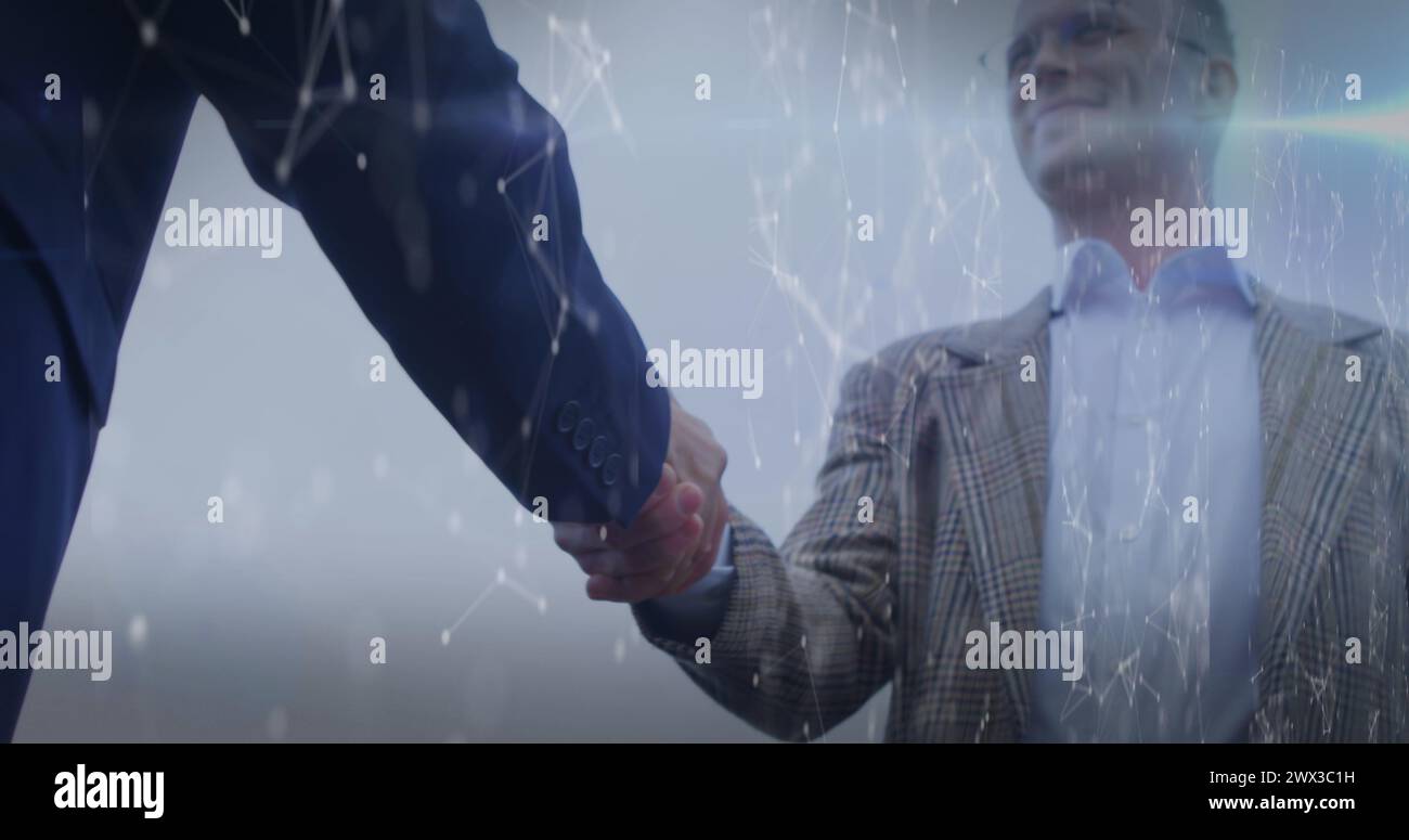 Image of network of connections over diverse business people shaking ...