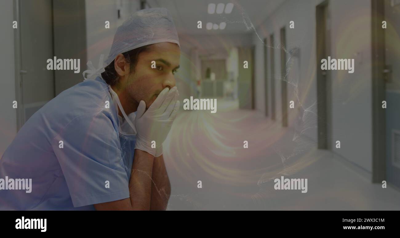 Image of moving spiral over sad biracial male nurse in hospital. mental ...