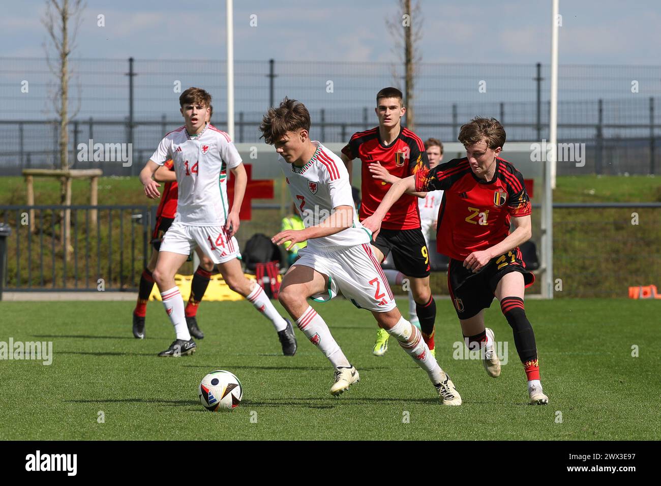 Frederick Issaka (7) of Wales and Devon De Corte (21) of Belgium ...