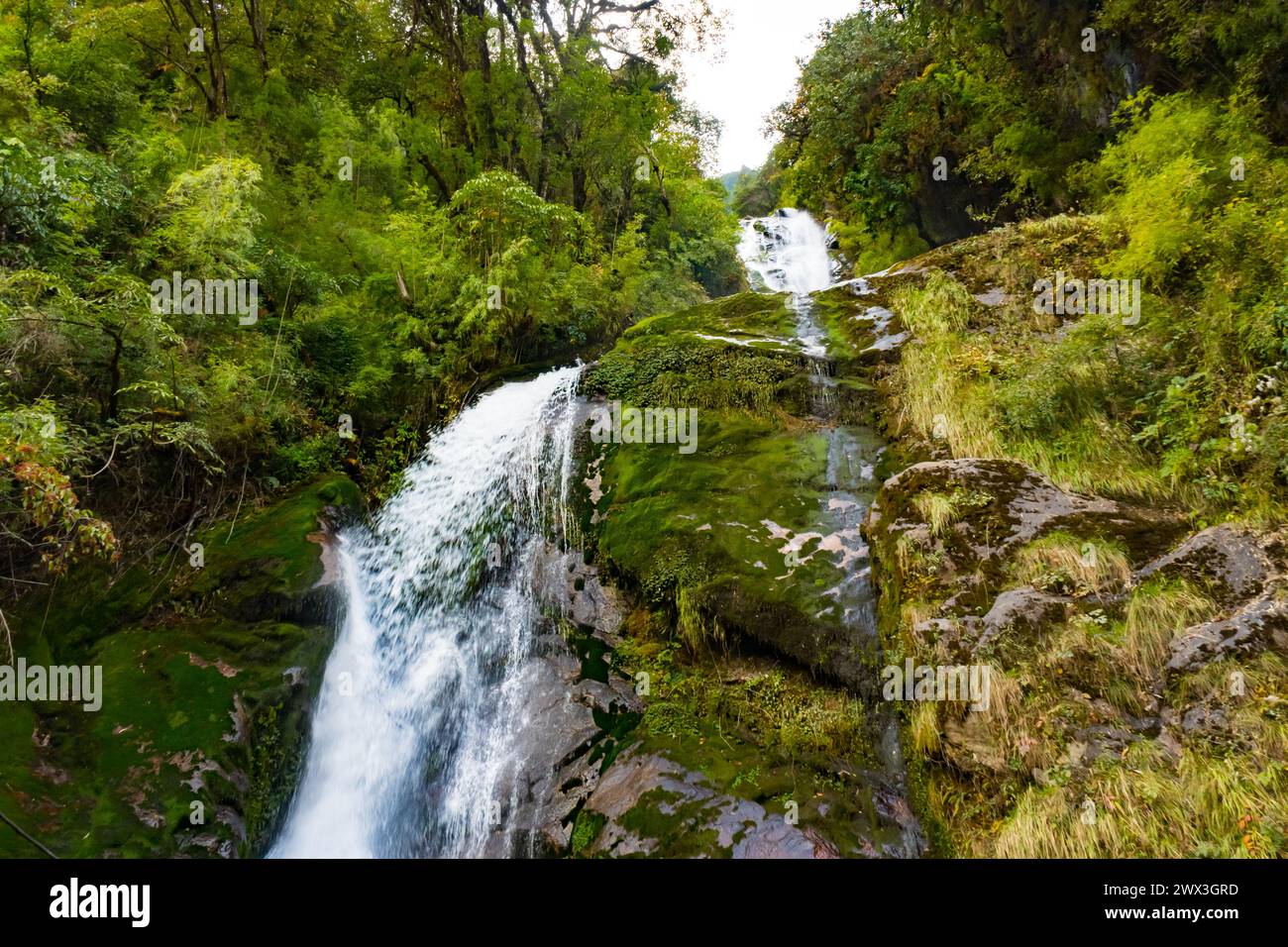 A waterfall with wooden bridge in Thangyam Village of Taplejung ...