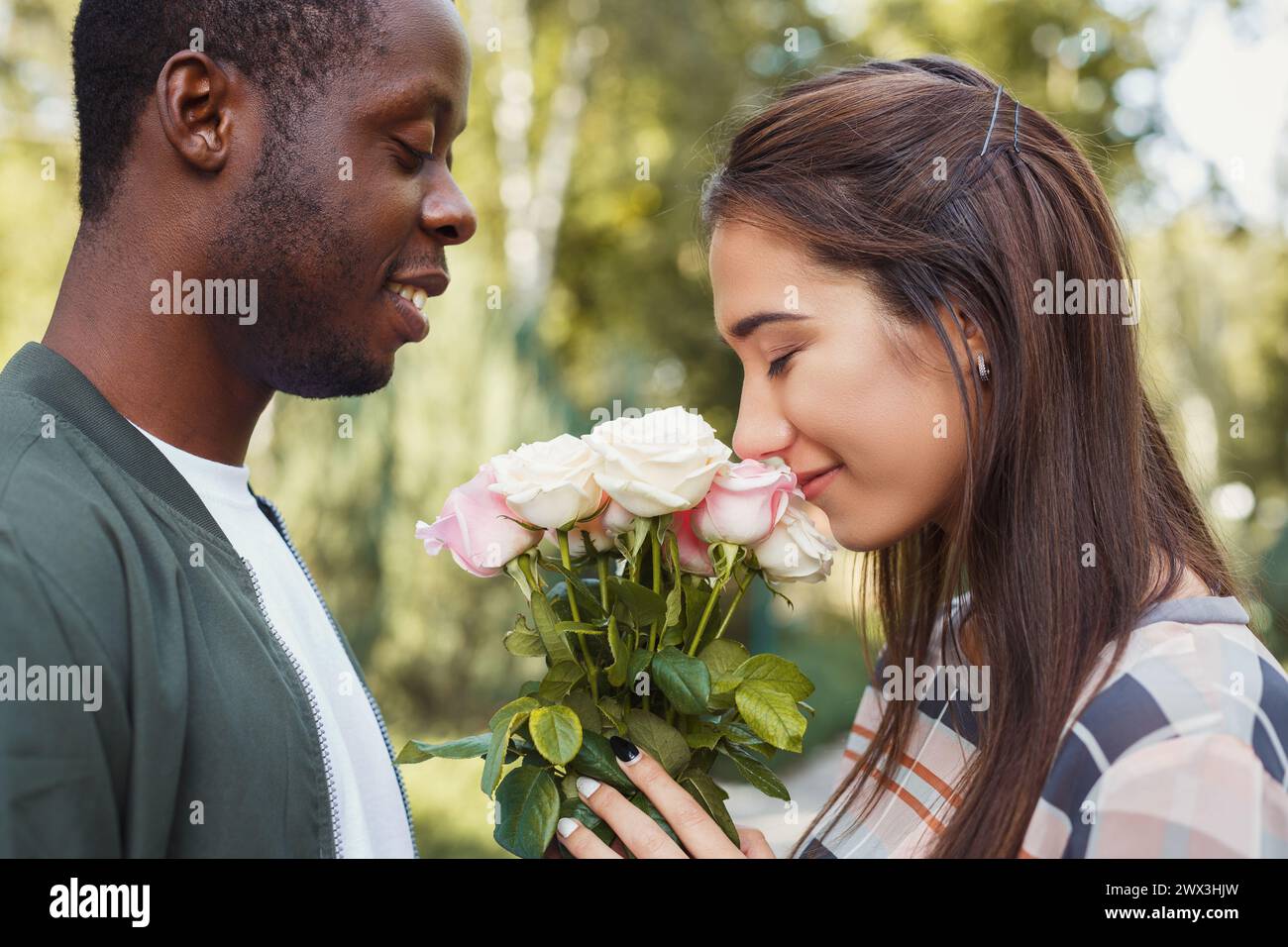 Man giving flowers for his beautiful girlfriend, having anniversary ...