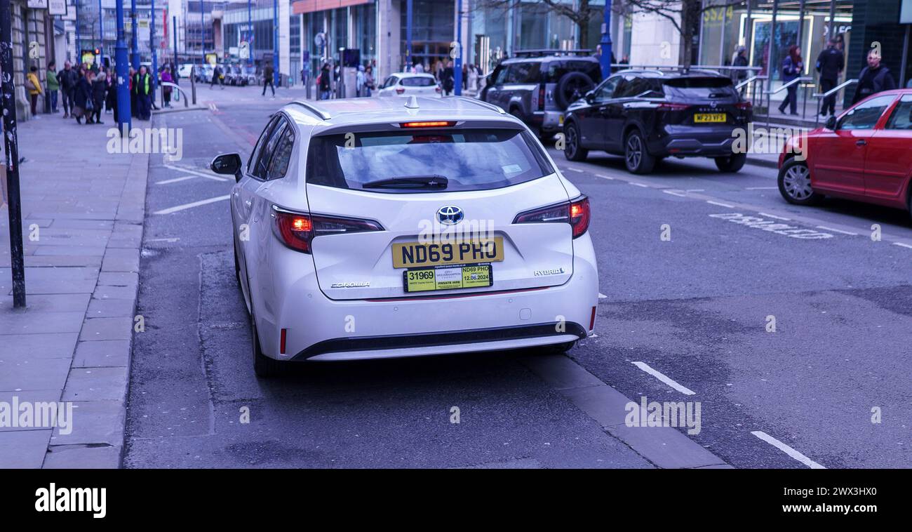 Electric vehicles in Manchester, UK Stock Photo - Alamy