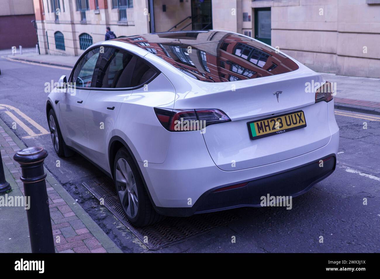 Electric vehicles in Manchester, UK Stock Photo - Alamy