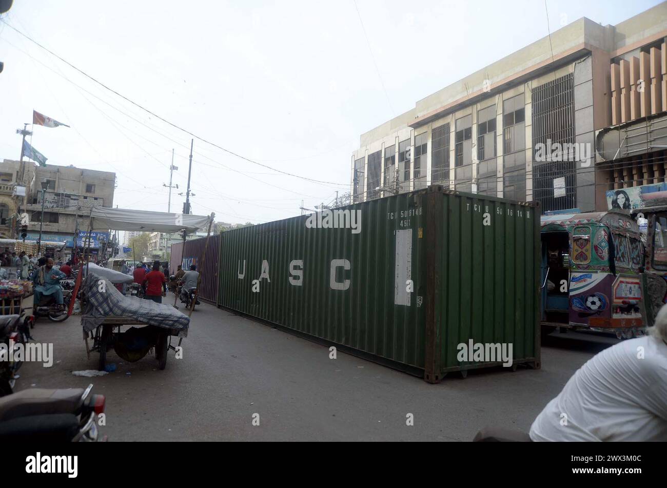 KARACHI, PAKISTAN, MAR 27: Containers are being placed by Sindh Police ...