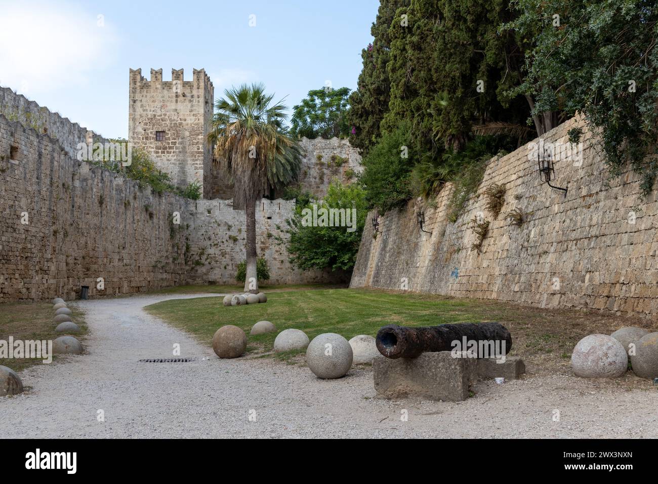 Cannon and trebuchet, catapult stones and walls in the moat of old town ...