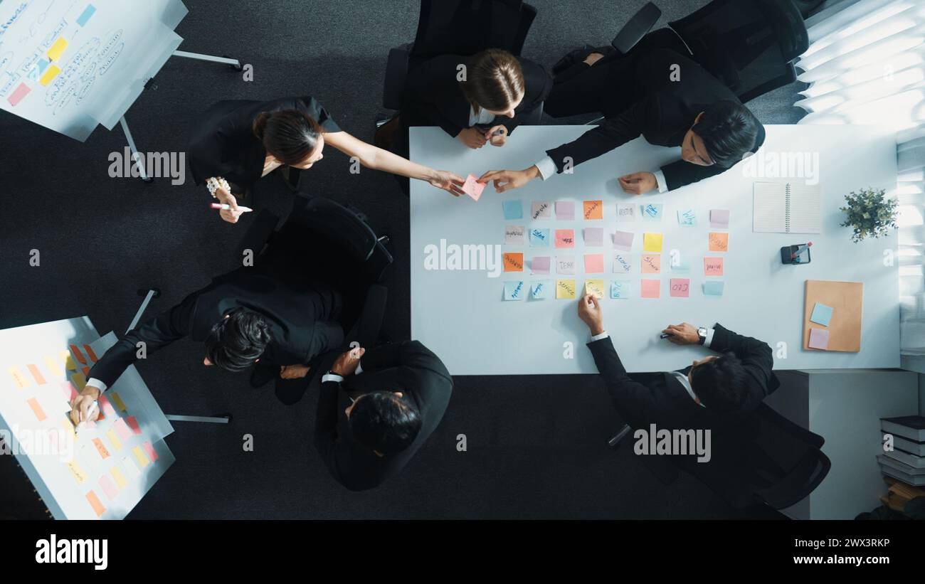 Top down aerial view of business group sharing and brainstorming idea ...
