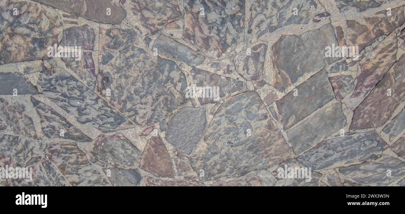 Cobblestone pavement made with quartzite undevastated slabs. Monumental ...
