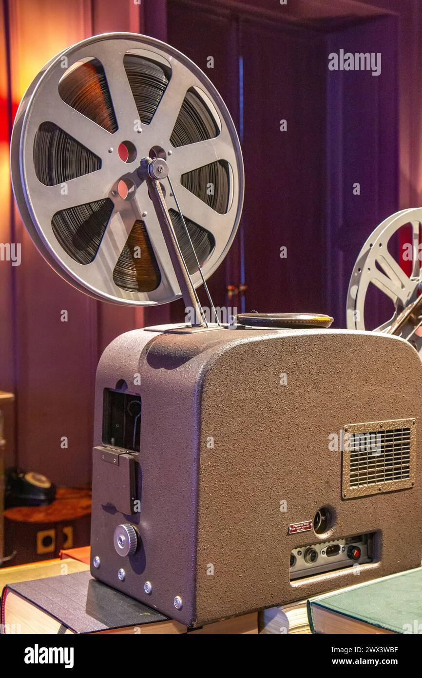Vintage old projector with tape in the dark room in the house Stock ...