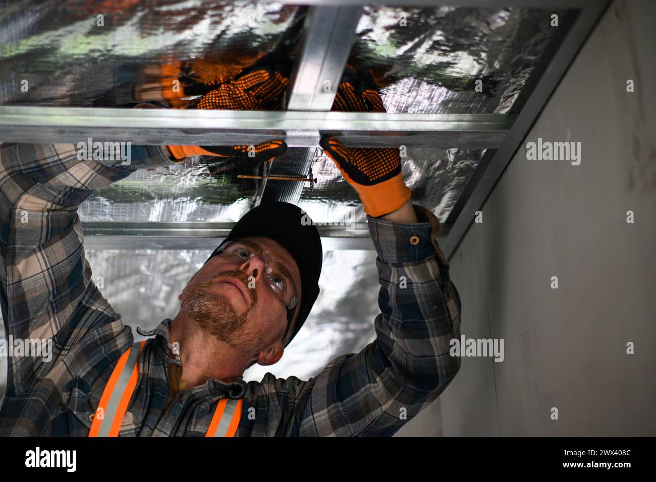 Plasterboard construction at home. installation of a metal frame on the ...