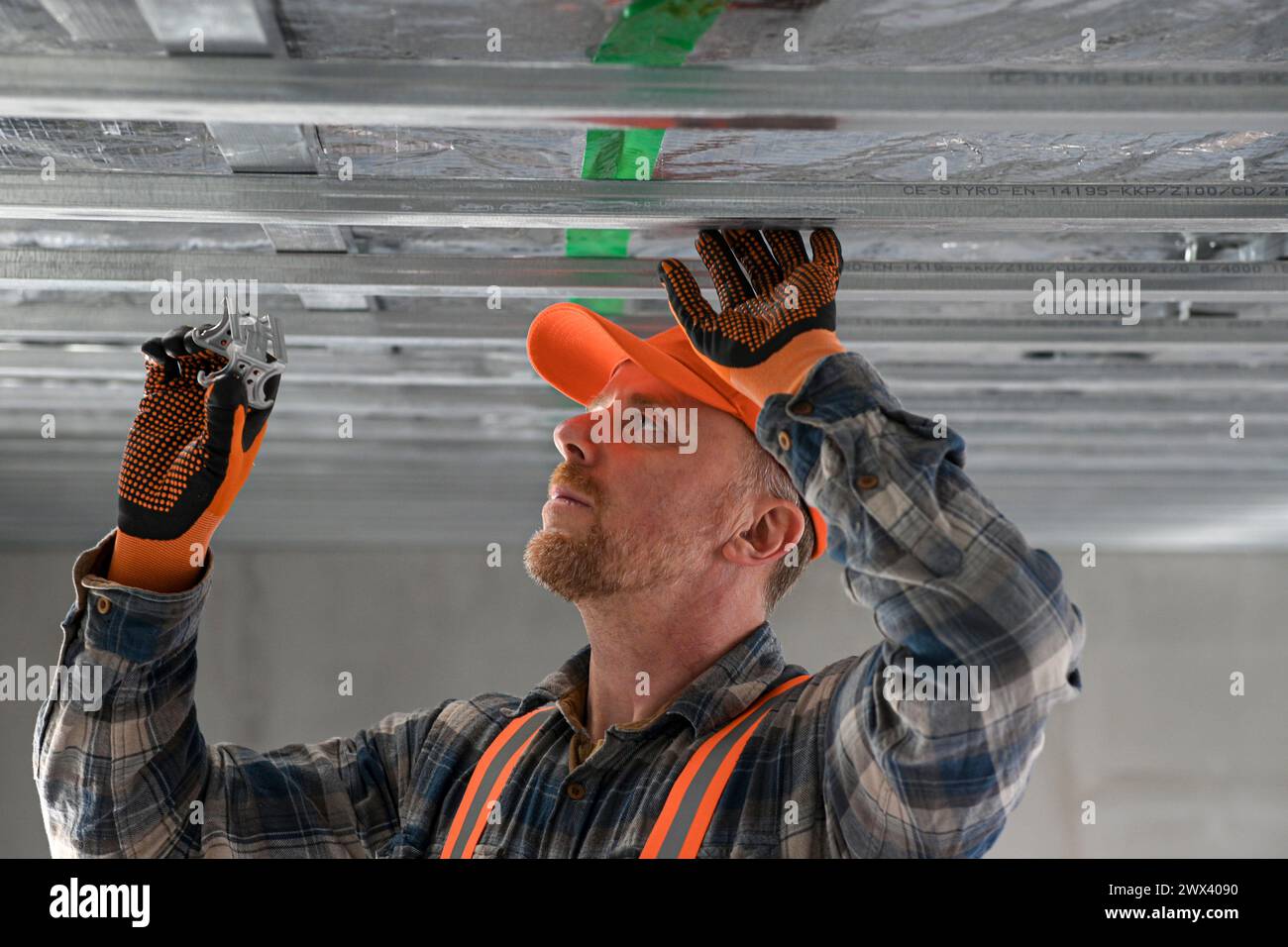 Plasterboard construction at home. installation of a metal frame on the ...