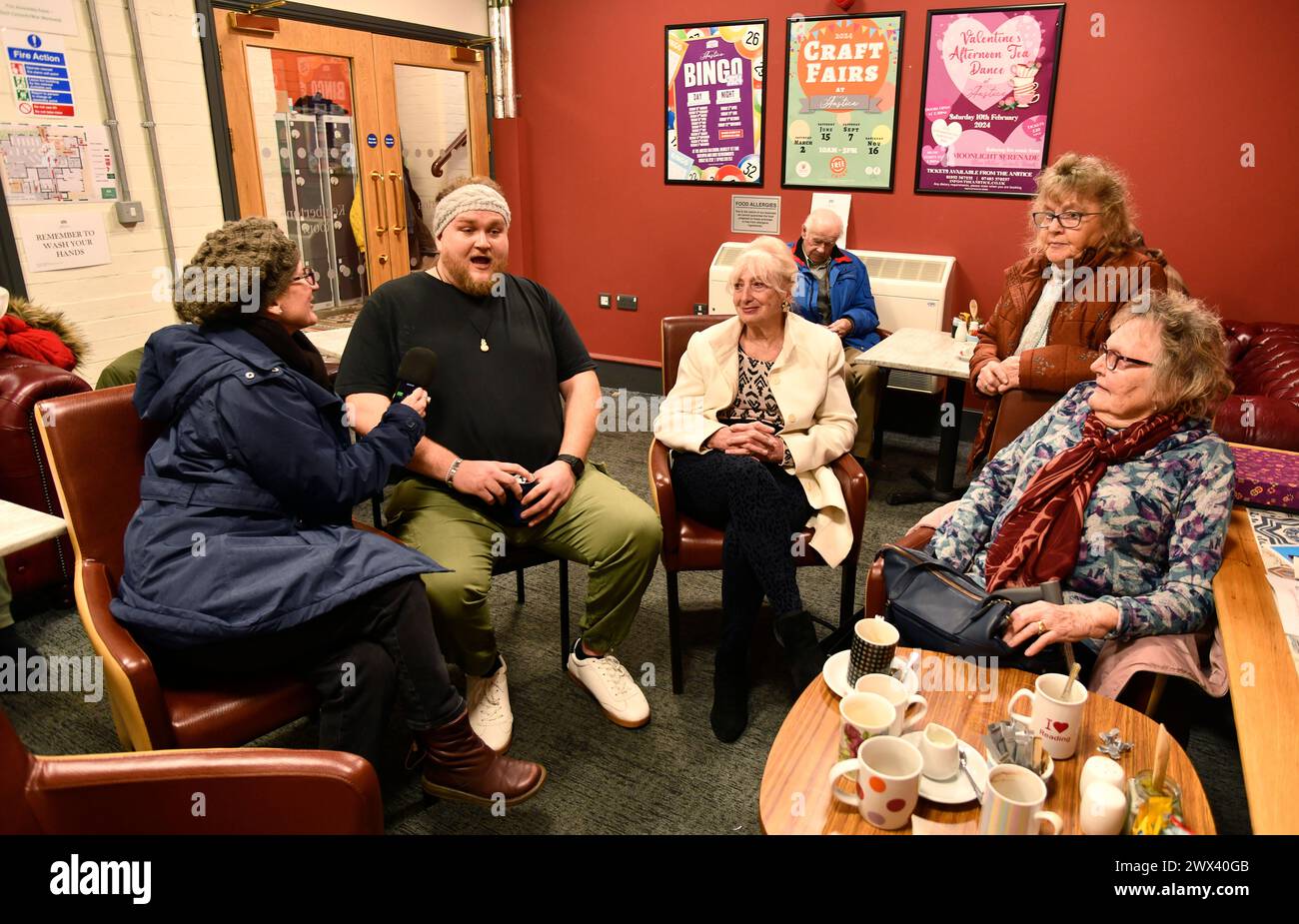 The 'Singing Builder' Callum Dougnie with admirers while being ...