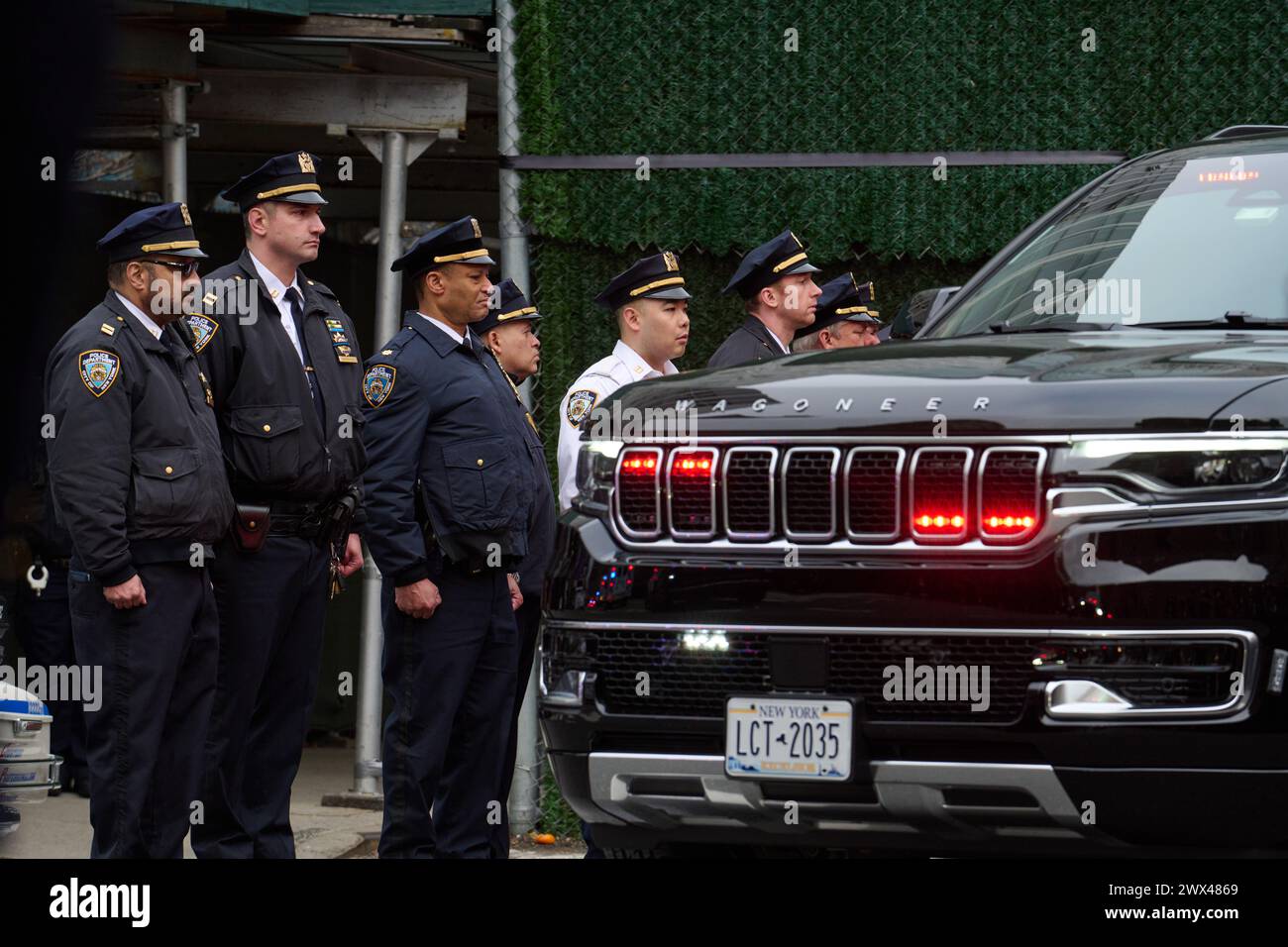 Brooklyn, New York, USA. 26th Mar, 2024. Members of the NYPD stand ...