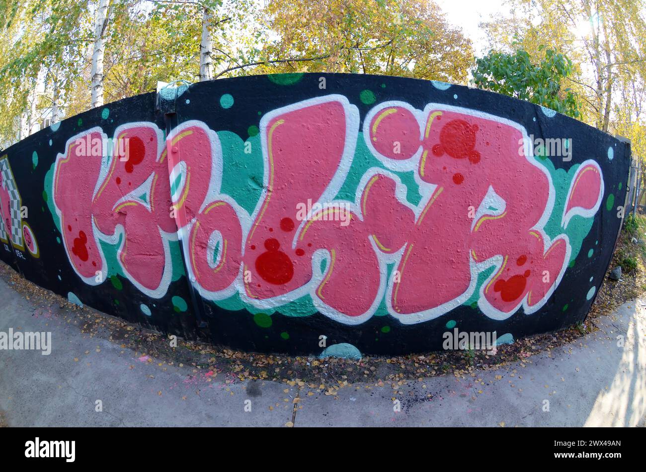 Fisheye shot of street art graffiti drawing on wall. Spray art artwork ...