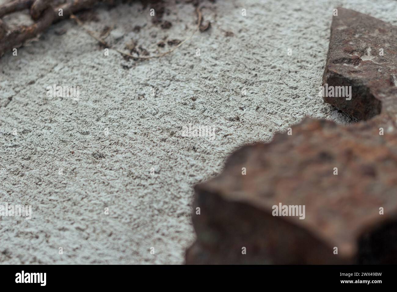 Abstract of Lumberman tools with broken rusted axe, head, chain on a ...