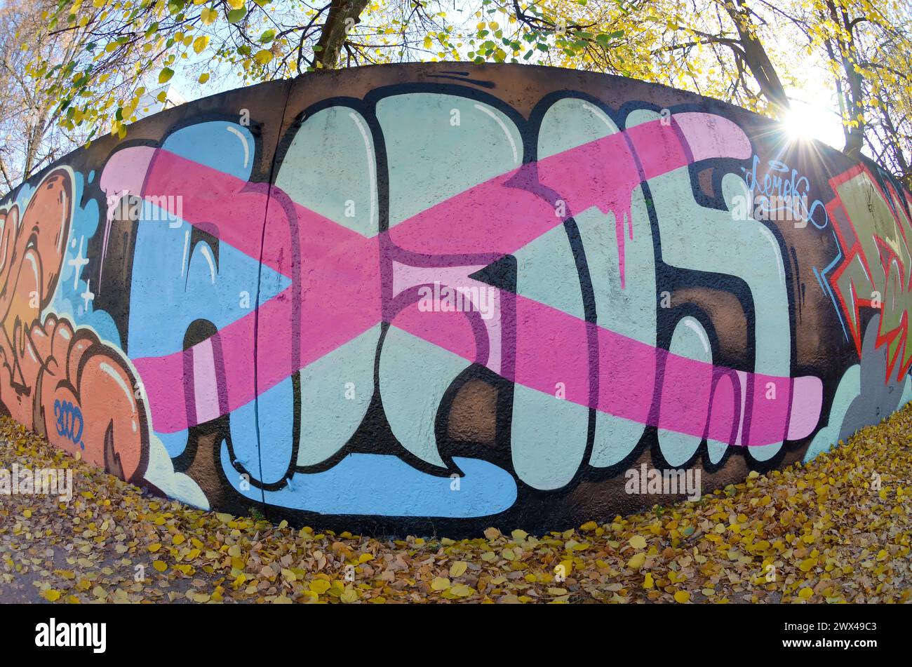 Fisheye shot of street art graffiti drawing on wall. Spray art artwork ...