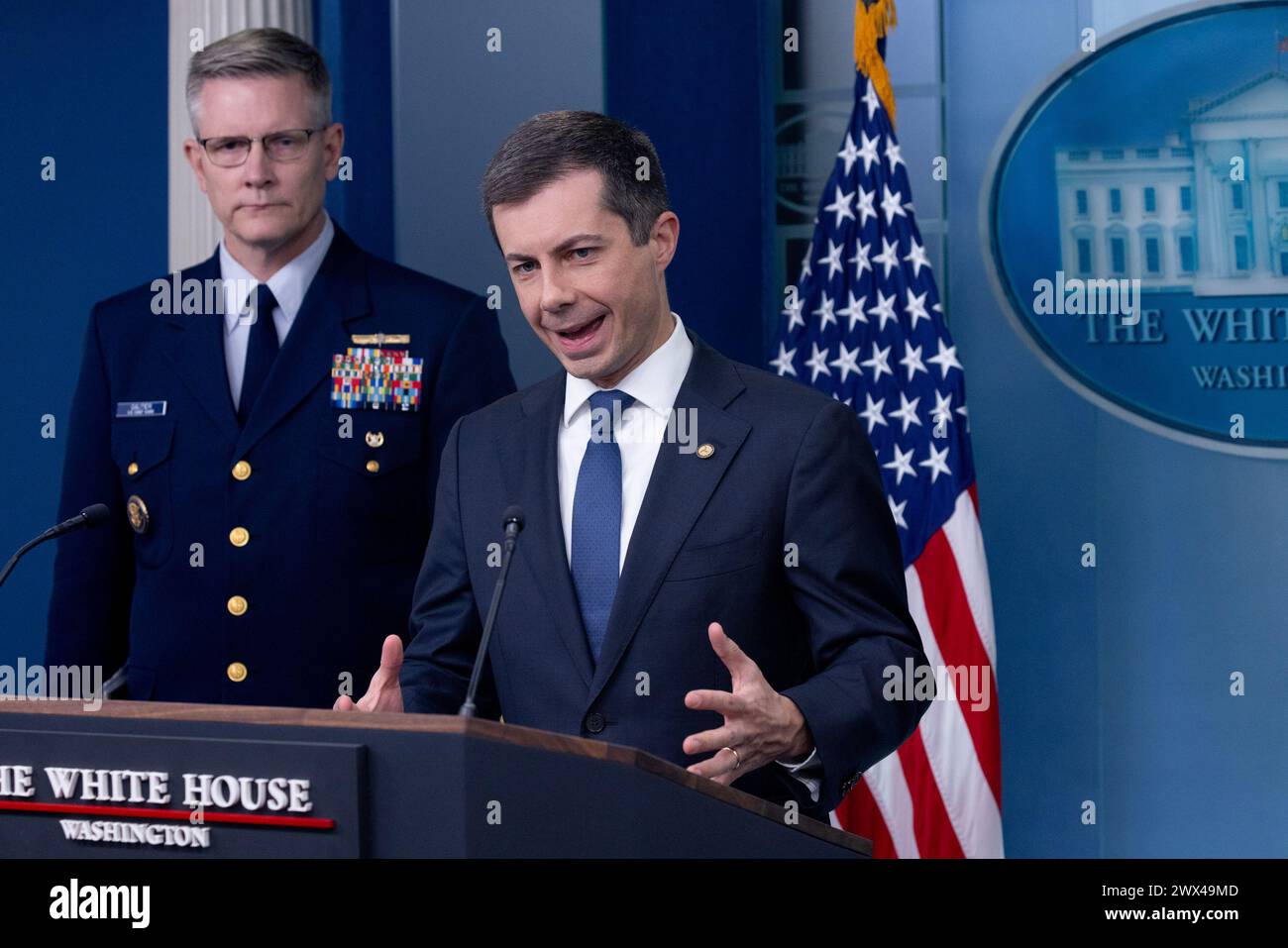 US Secretary of Transportation Pete Buttigieg (R) and Deputy Commandant ...