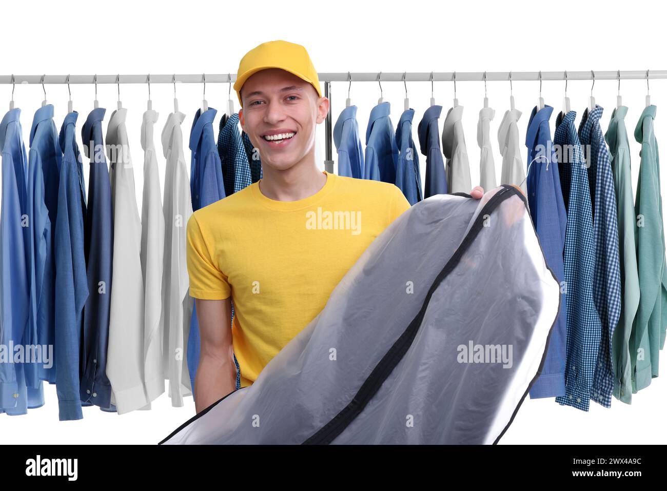 Dry-cleaning delivery. Happy courier holding garment cover with clothes ...