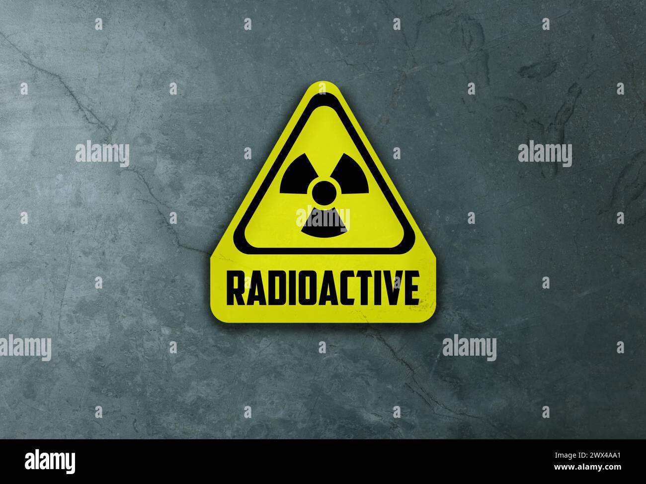 Radioactive sign on grey stone wall. Hazard symbol Stock Photo - Alamy