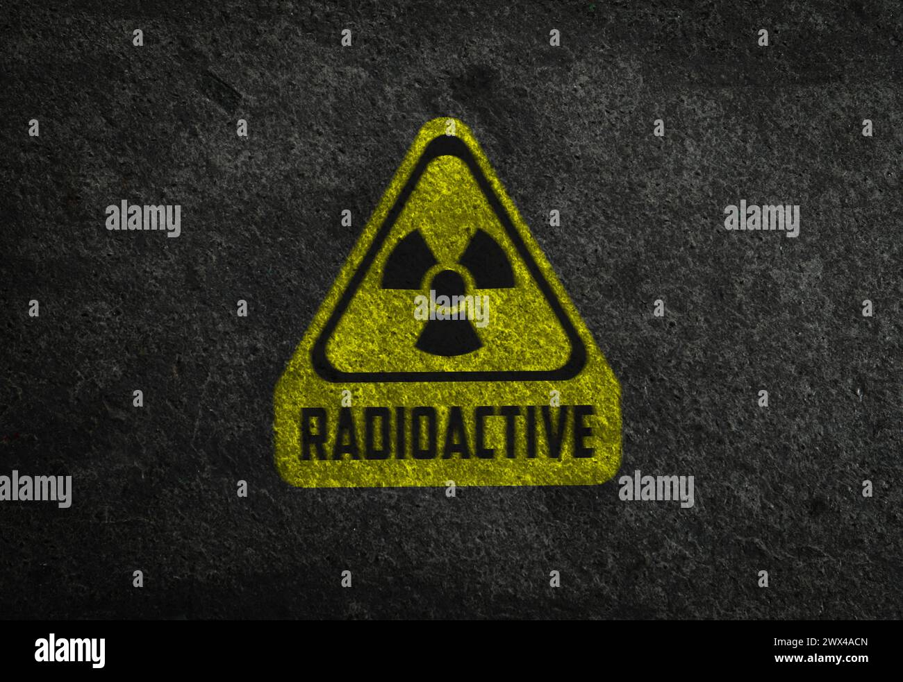 Radioactive sign on grey stone wall. Hazard symbol Stock Photo - Alamy