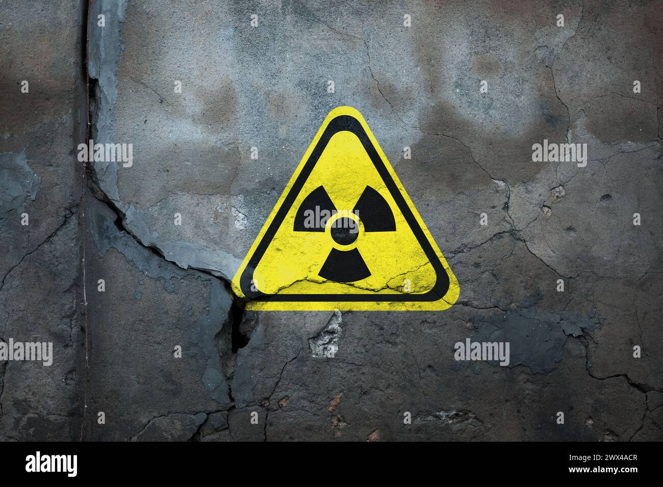 Radioactive sign on old cracked wall. Hazard symbol Stock Photo - Alamy