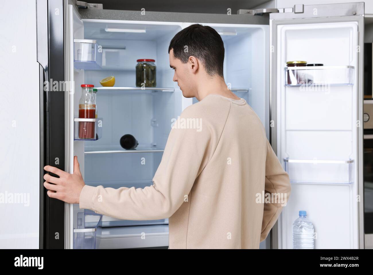 Empty fridge man hi-res stock photography and images - Alamy