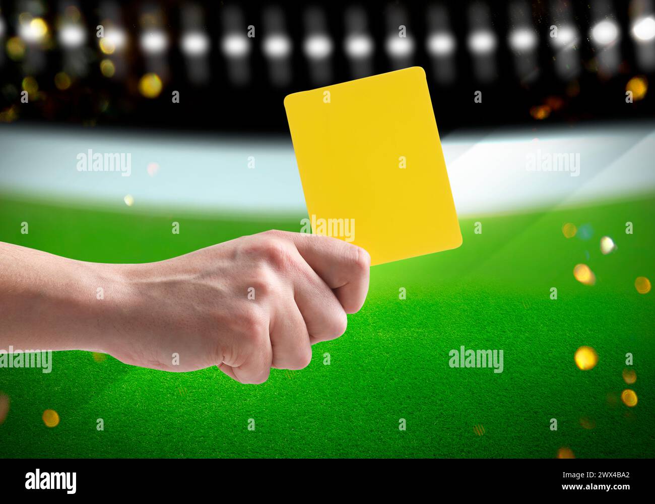 Referee holding yellow card at stadium, closeup Stock Photo - Alamy