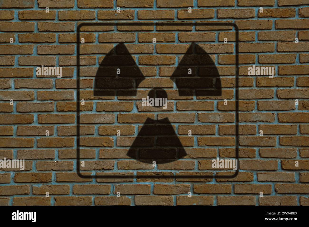 Radioactive sign on brick wall. Hazard symbol Stock Photo - Alamy