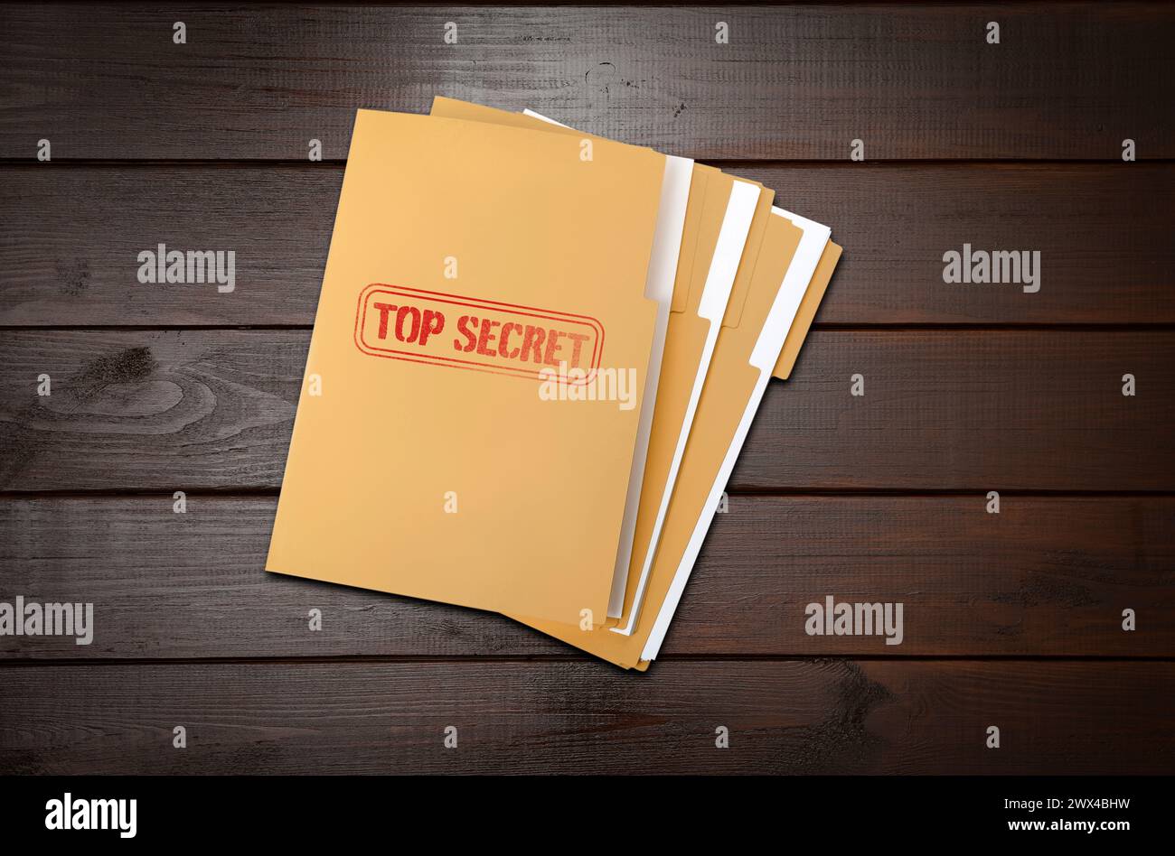 Top Secret stamp. Files with documents on wooden table, top view Stock ...
