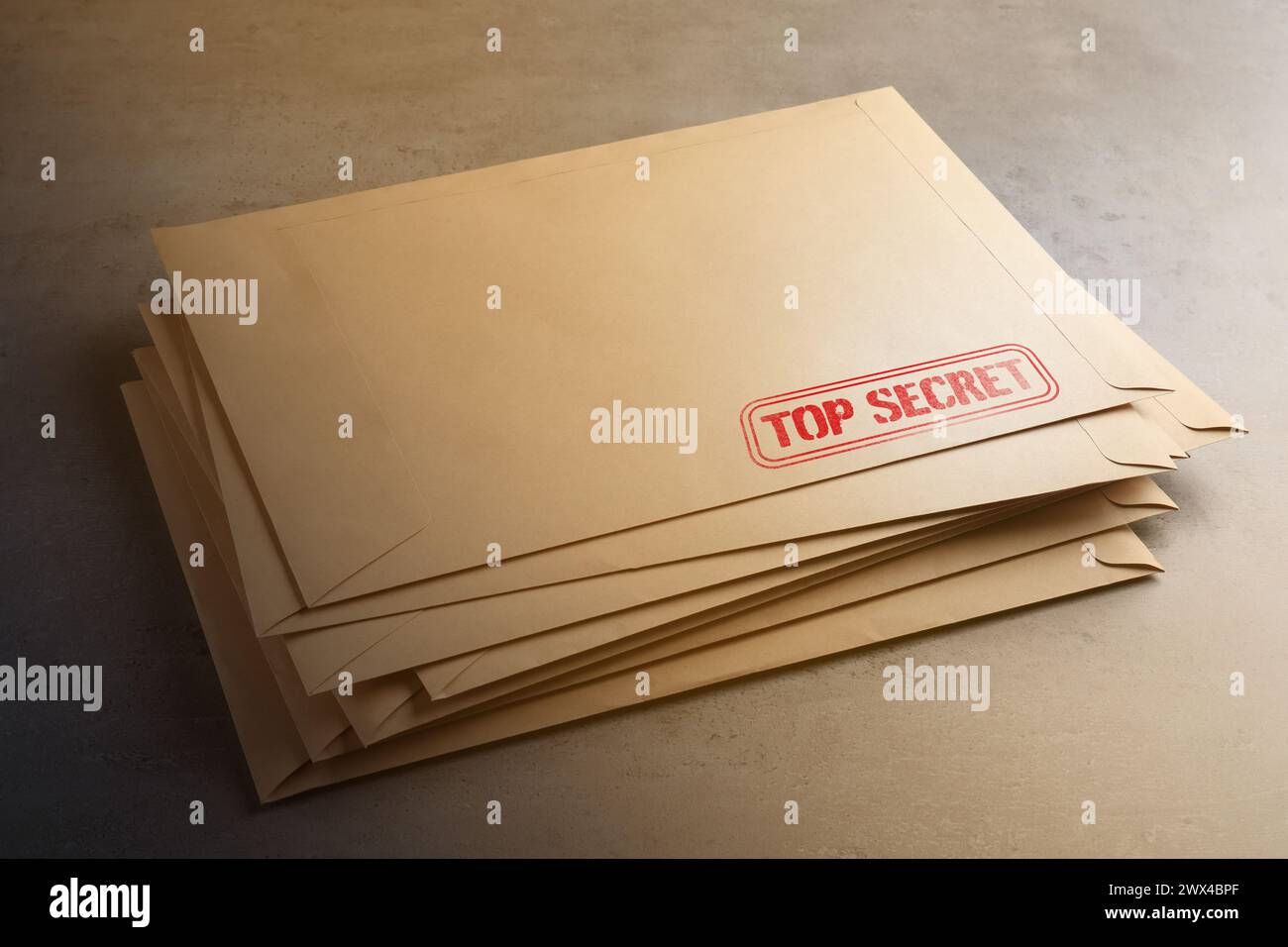 Top Secret stamp. Stacked paper envelopes on table Stock Photo - Alamy