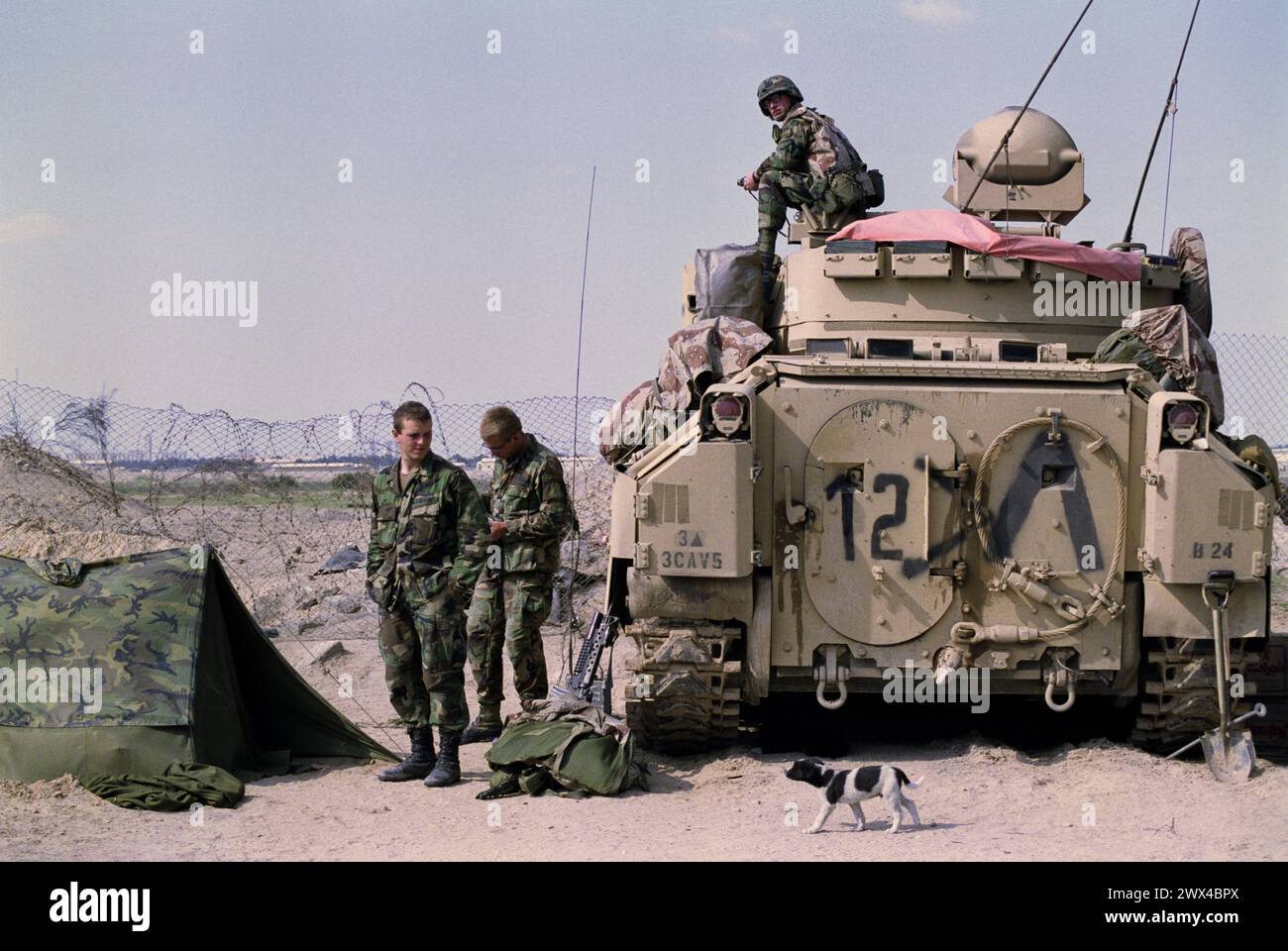 25th March 1991 U.S. Army soldiers relax next to their Bradley Cavalry ...