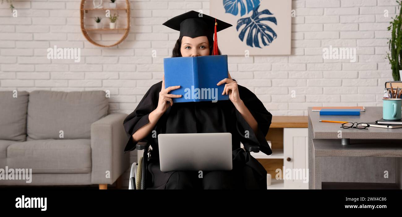 Female student with physical disability in graduation cap and gown ...
