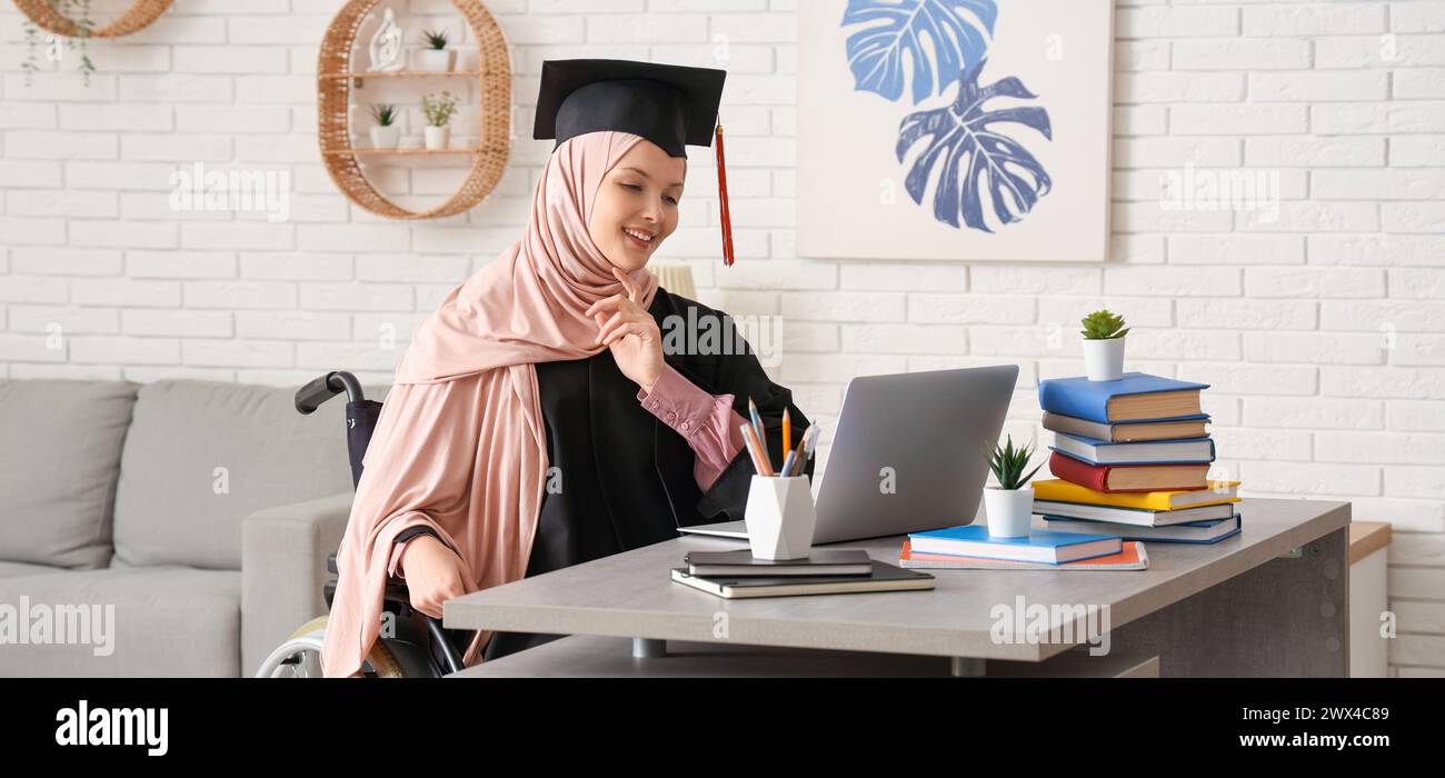Young Muslim girl with physical disability, in graduation cap and gown ...