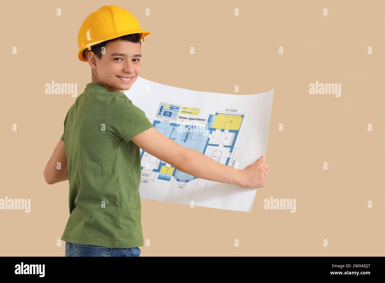 Little architect with house plan on beige background, back view Stock ...