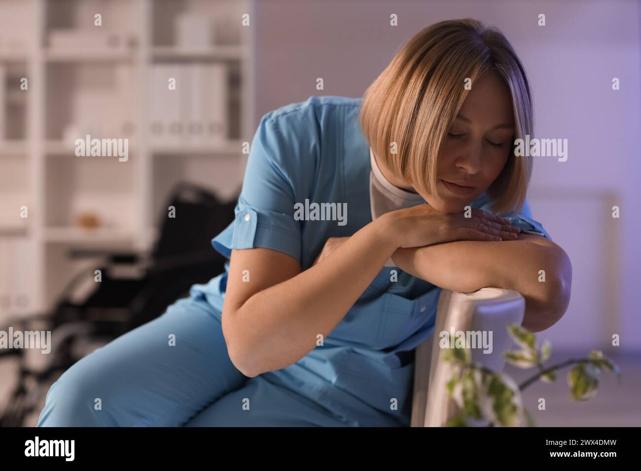 Tired female doctor sleeping in hi-res stock photography and images - Alamy