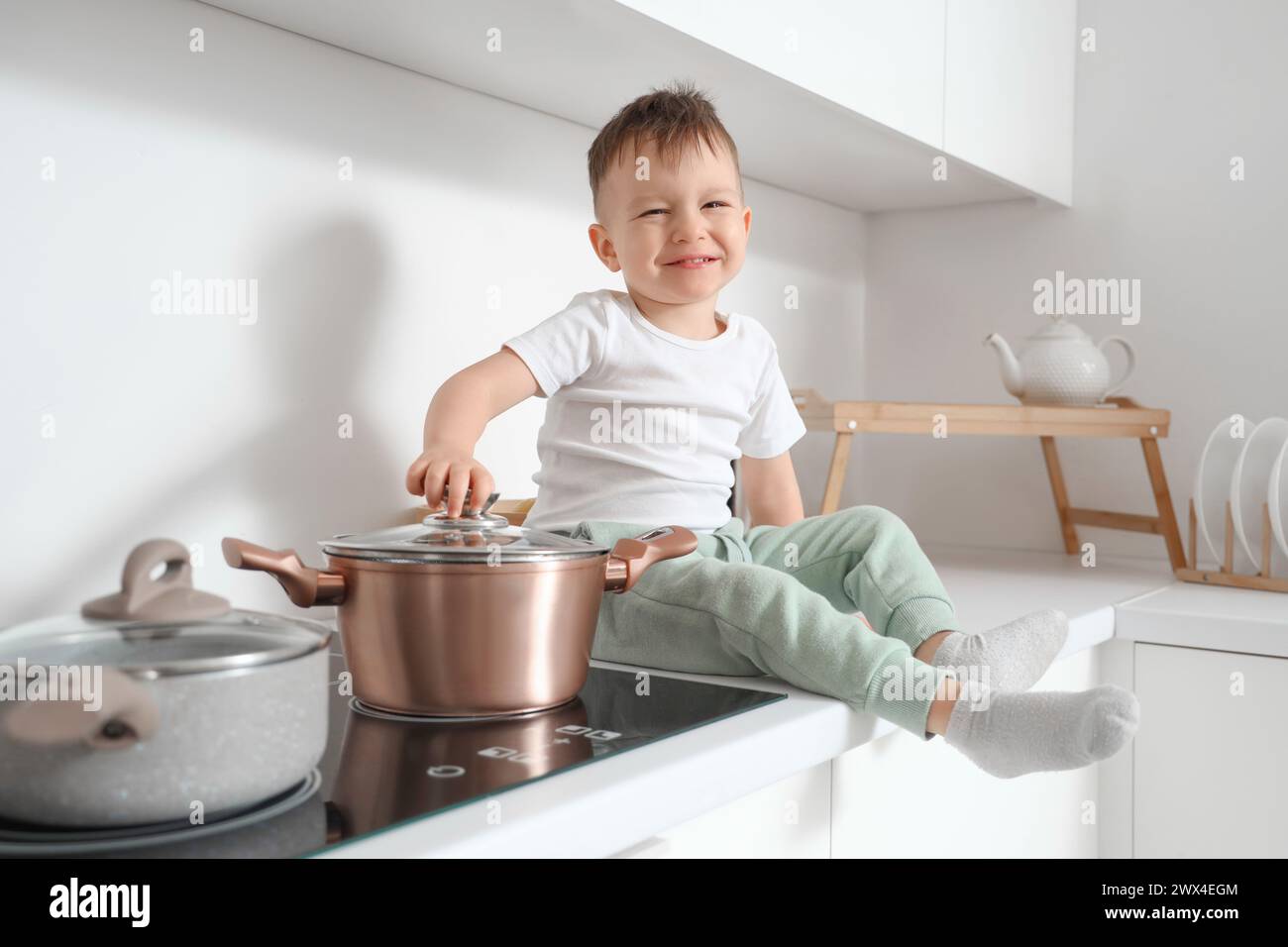Child pot stove hi-res stock photography and images - Alamy
